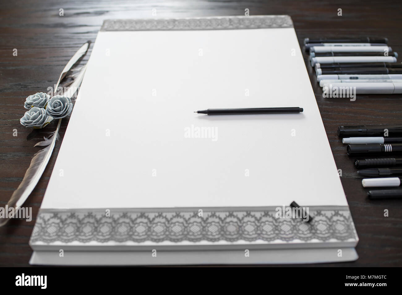 Background for creative pictures - Large paper block on dark oak table ...