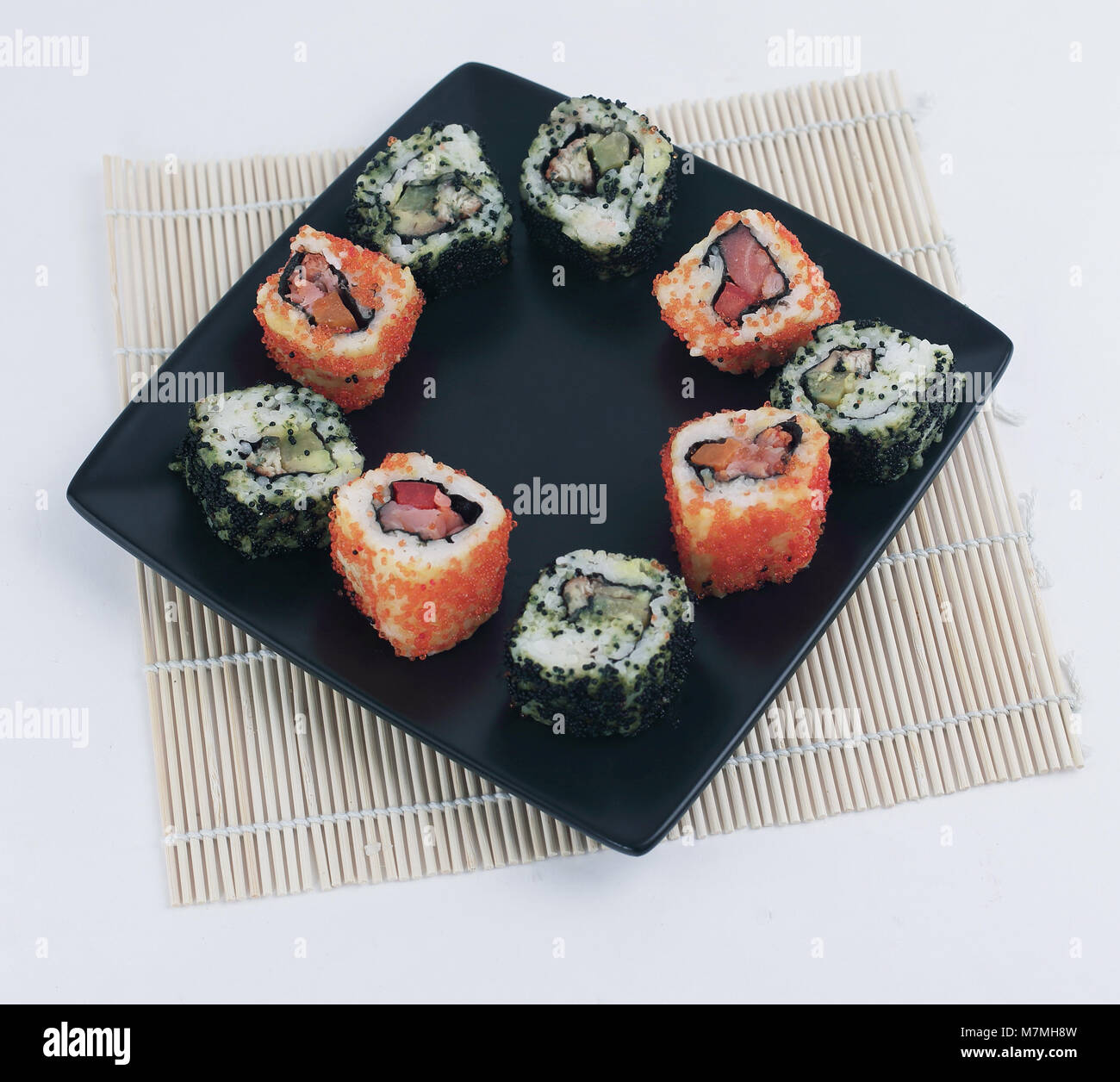 different types of Maki sushi on a black plate Stock Photo - Alamy