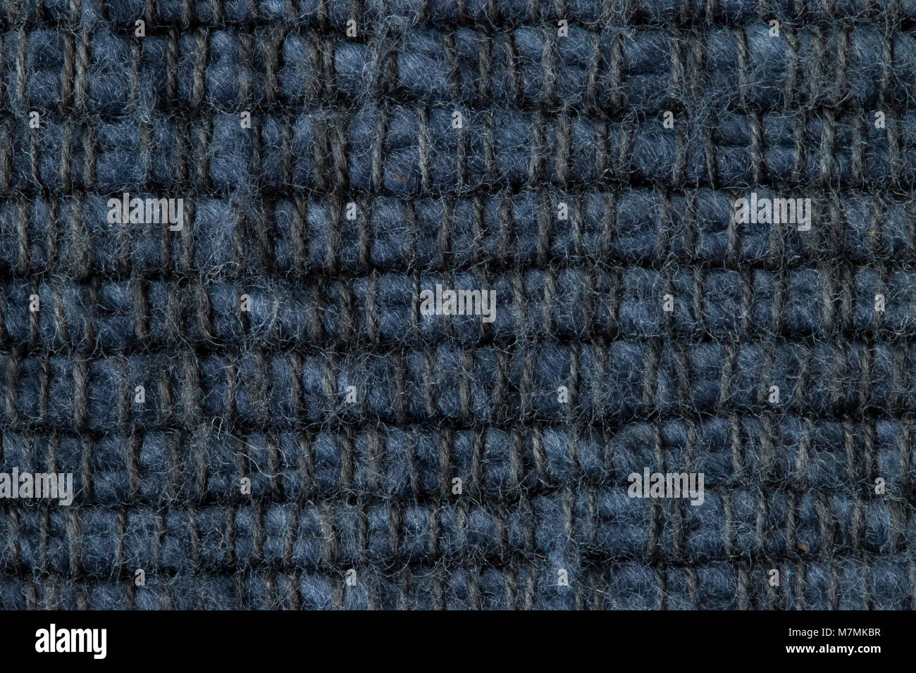 navy blue knitted ethnic fabric texture background Stock Photo - Alamy