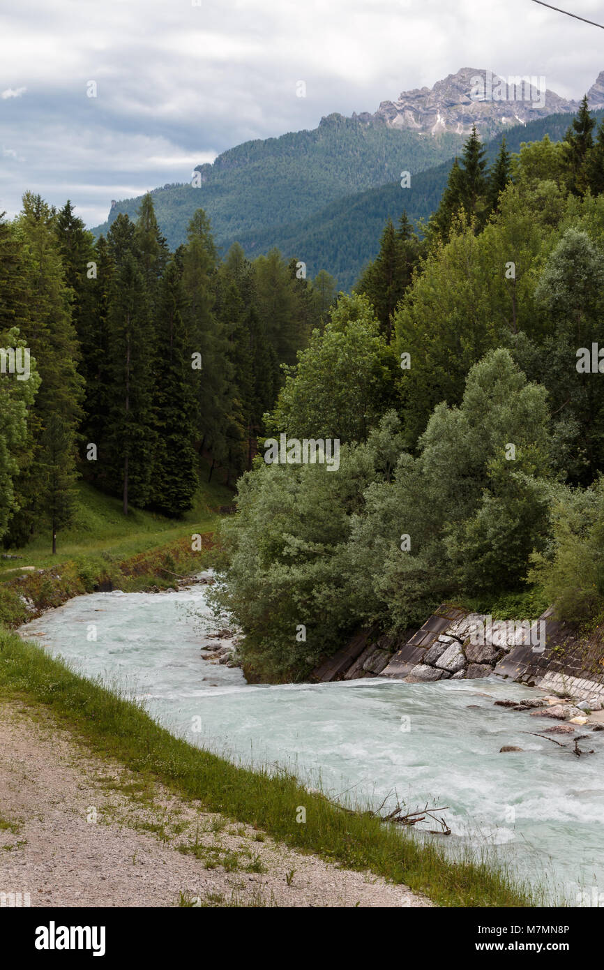 Stream with White Pure Water and Mountains Peaks in background Stock ...
