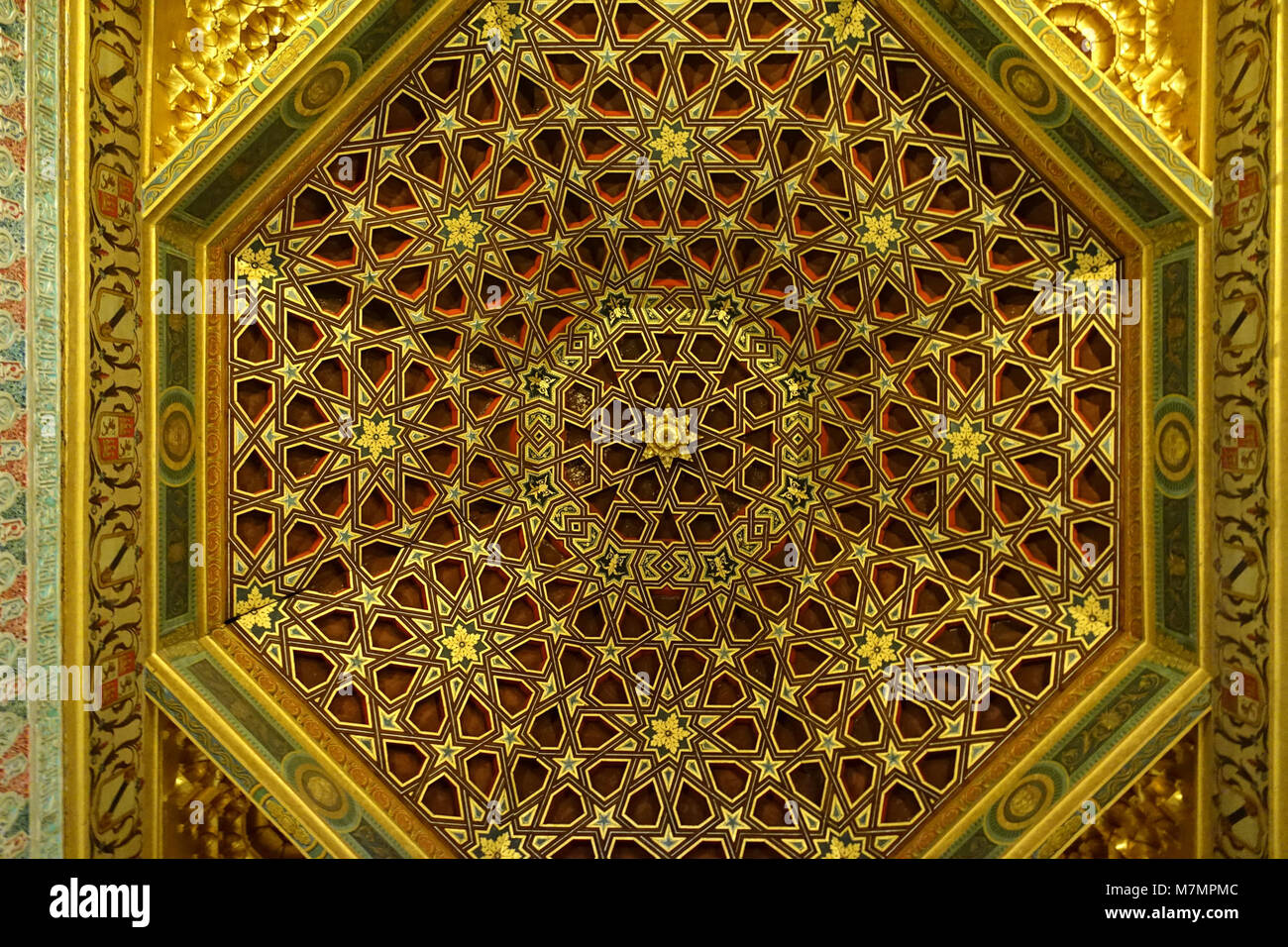 This image depicts the intricate ceiling design in the Alcázar of ...