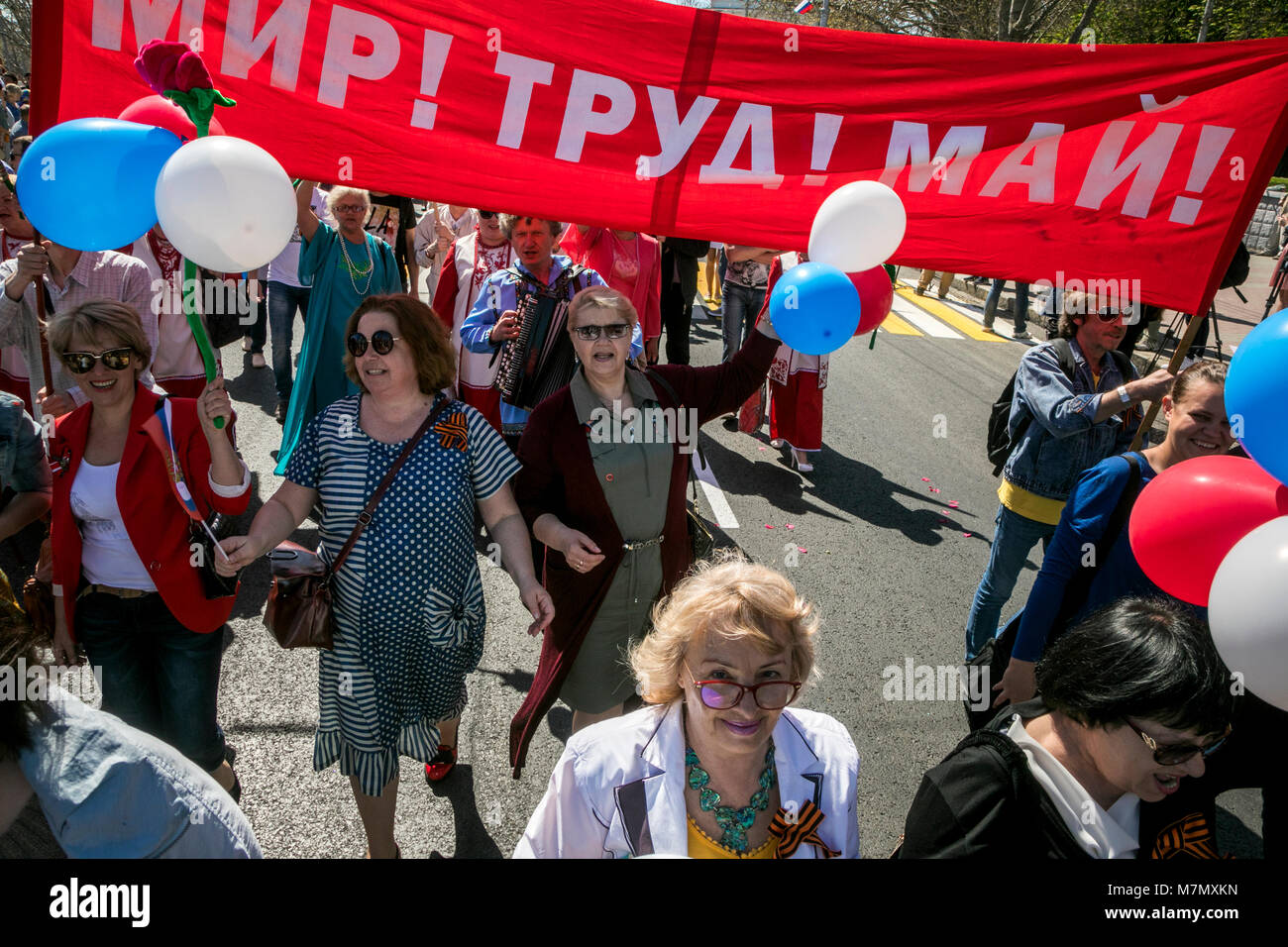 Participants in the May Day procession of the Communist Party are ...