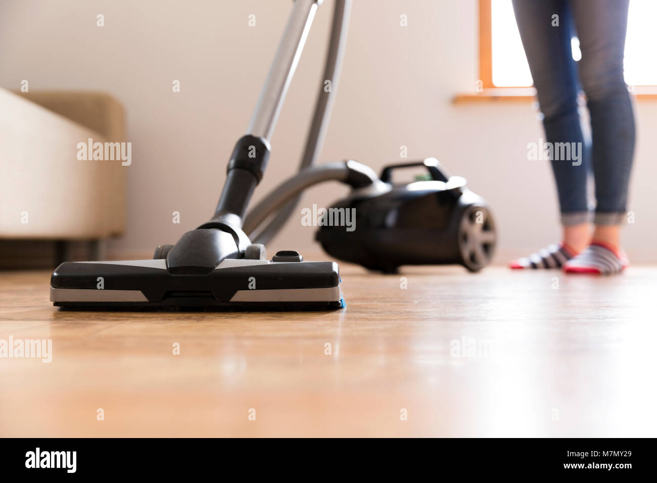 People, housework and housekeeping concept - happy woman with vacuum ...