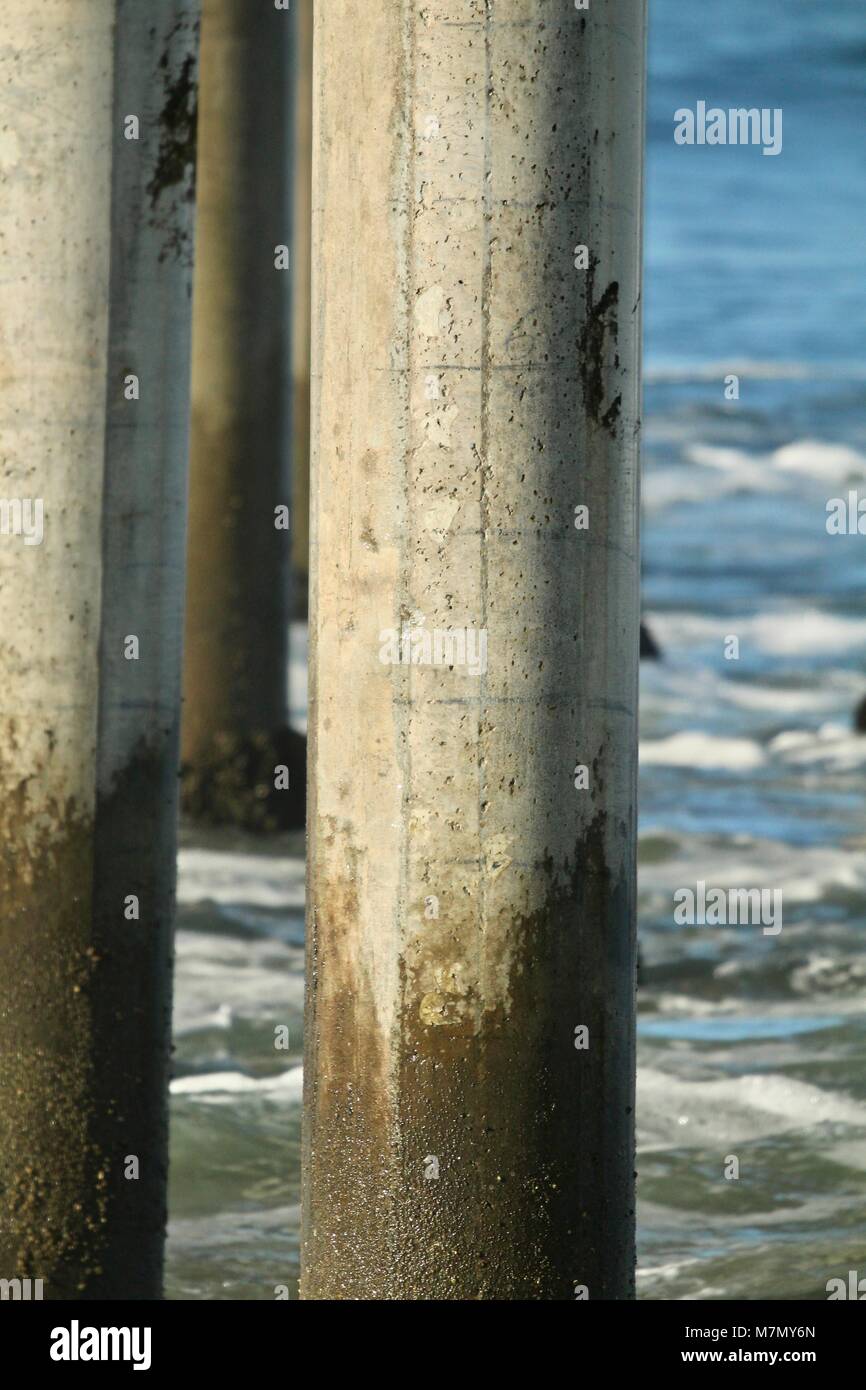 waves crashing on pier pilings Stock Photo - Alamy