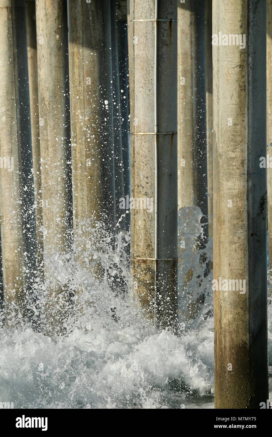 waves crashing on pier pilings Stock Photo - Alamy