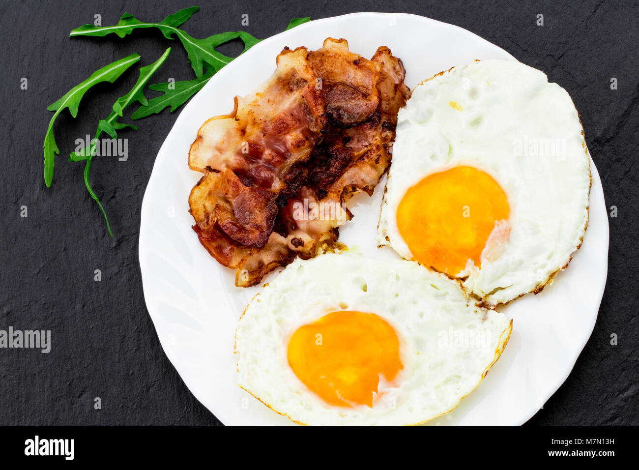 English breakfast - fried egg and bacon. Top view Stock Photo - Alamy