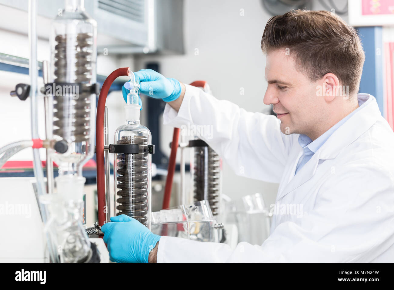 Scientist in research lab analyzing samples Stock Photo - Alamy