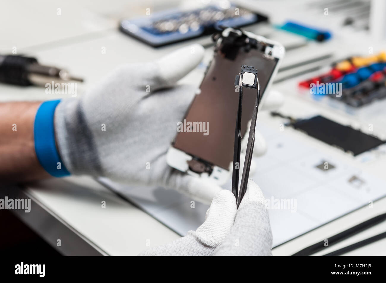 Close-up photos showing process of mobile phone repair Stock Photo - Alamy