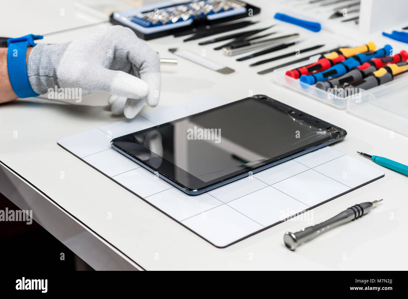 Close-up photos showing process of tablet device repair Stock Photo - Alamy