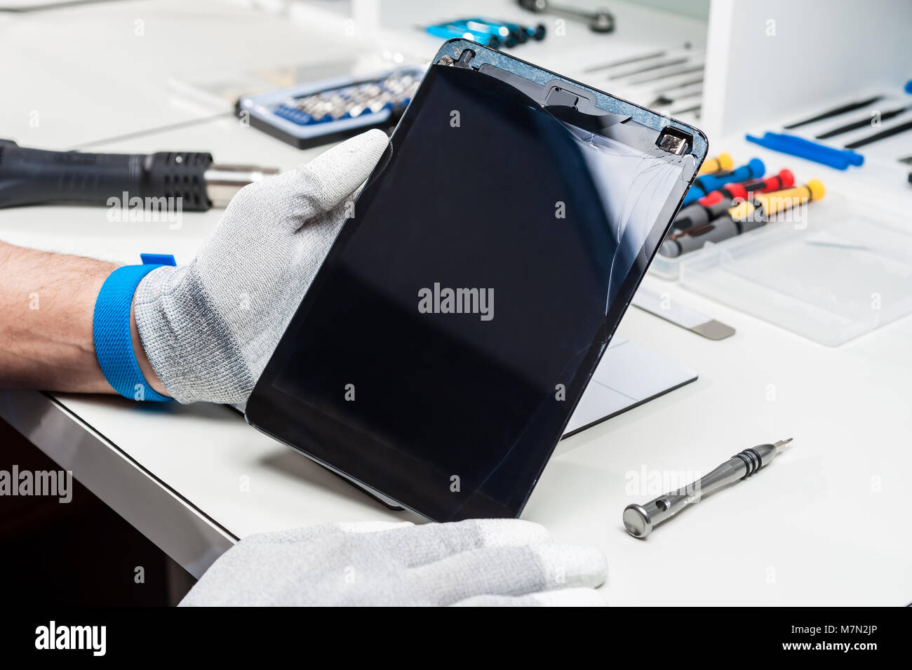 Close-up photos showing process of tablet device repair Stock Photo - Alamy