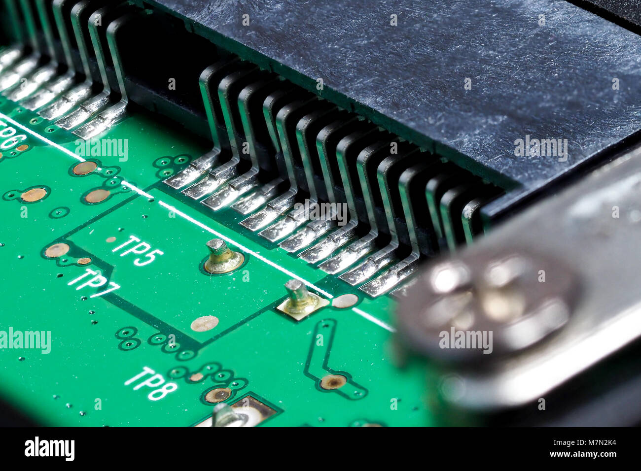 Closeup of green computer mother board, electronic elements and circuit ...