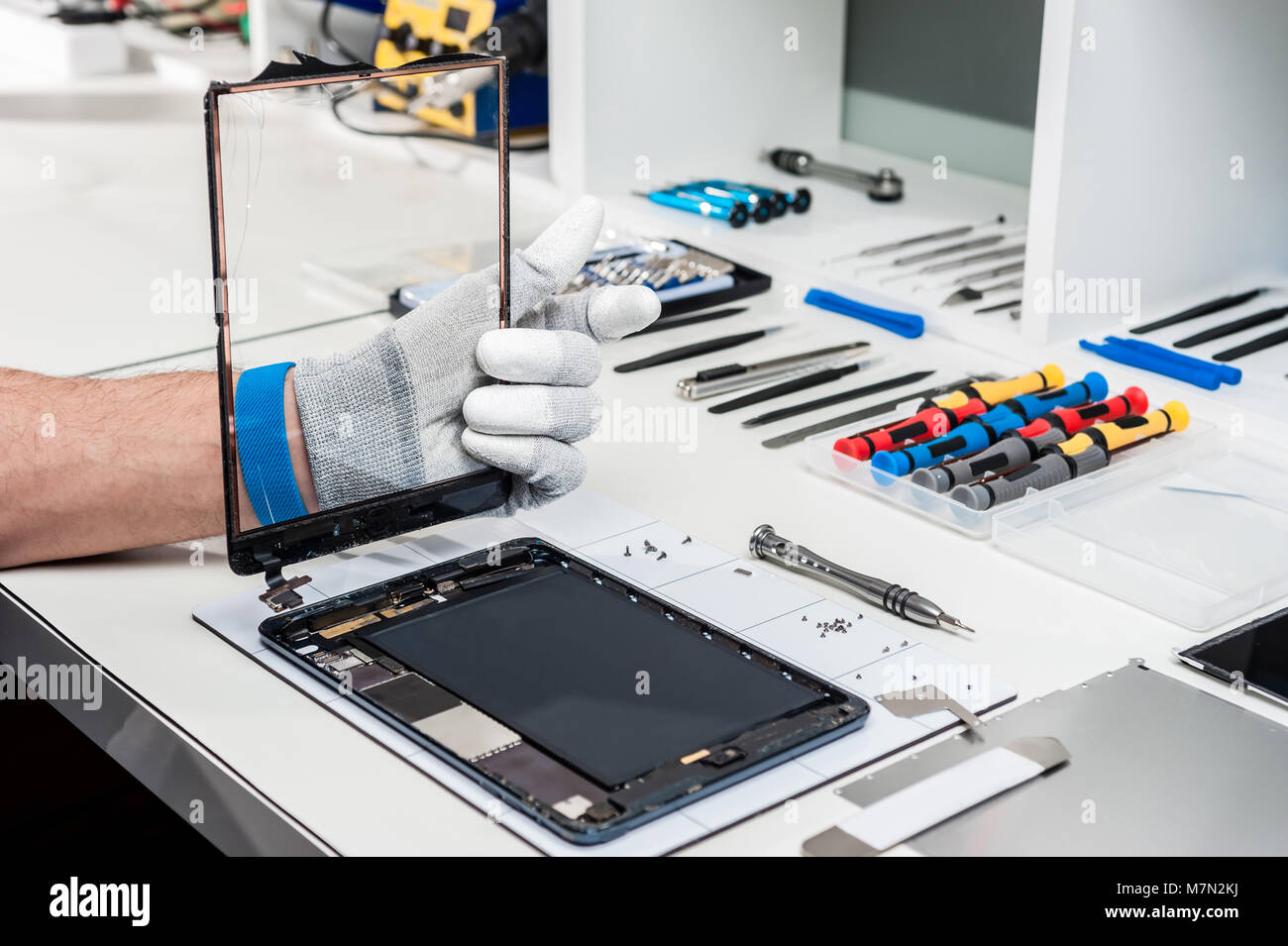 Close-up photos showing process of tablet device repair Stock Photo - Alamy