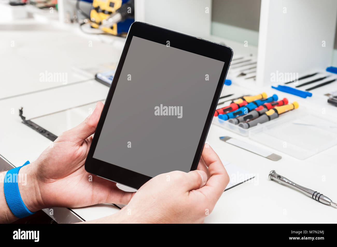 Close-up photos showing process of tablet device repair Stock Photo - Alamy