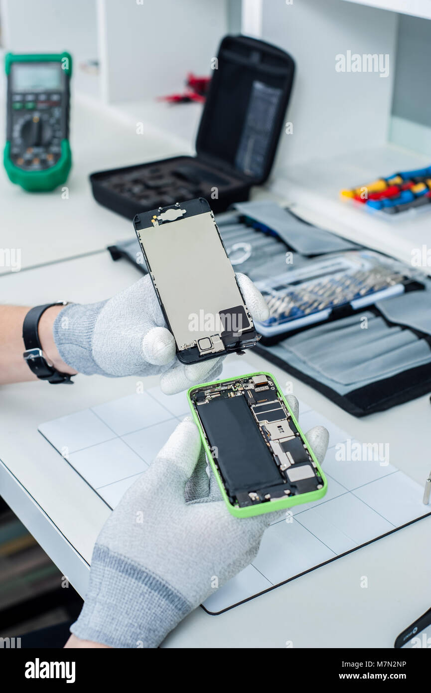 Close-up photos showing process of mobile phone repair Stock Photo - Alamy