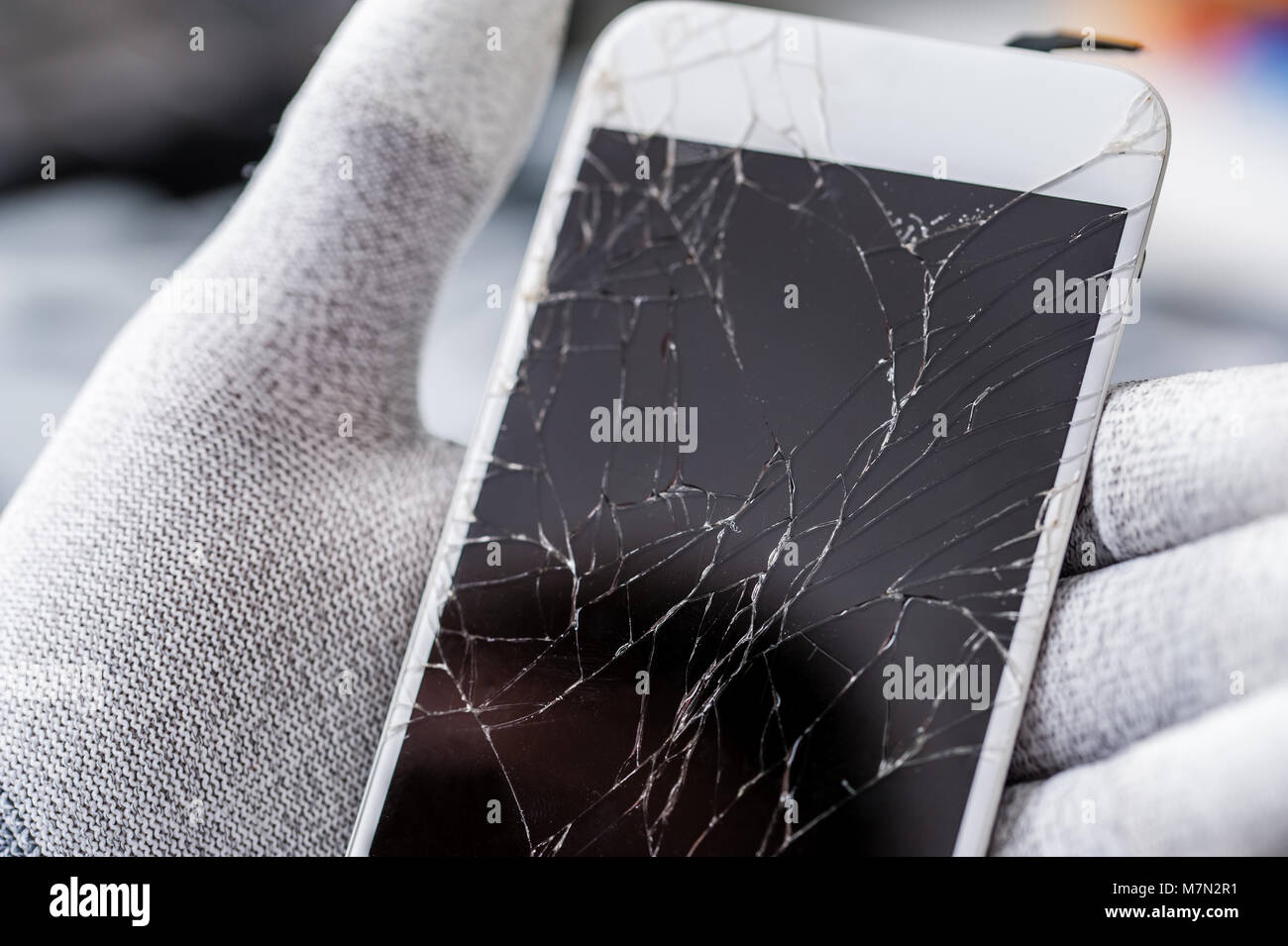 Close-up photos showing process of mobile phone repair, changing the ...