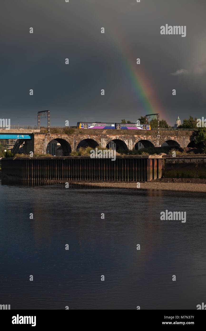 A Northern Rail class 142 pacer train crosses Carlisle Bridge ...