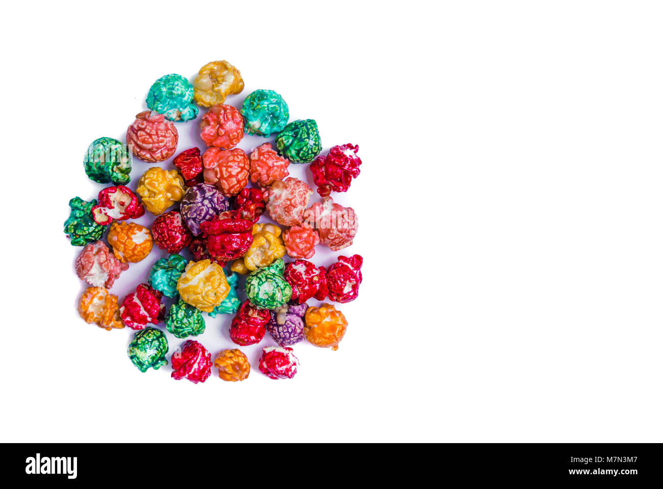 Brightly Colored Candied Popcorn, white background. Horizontal image of ...