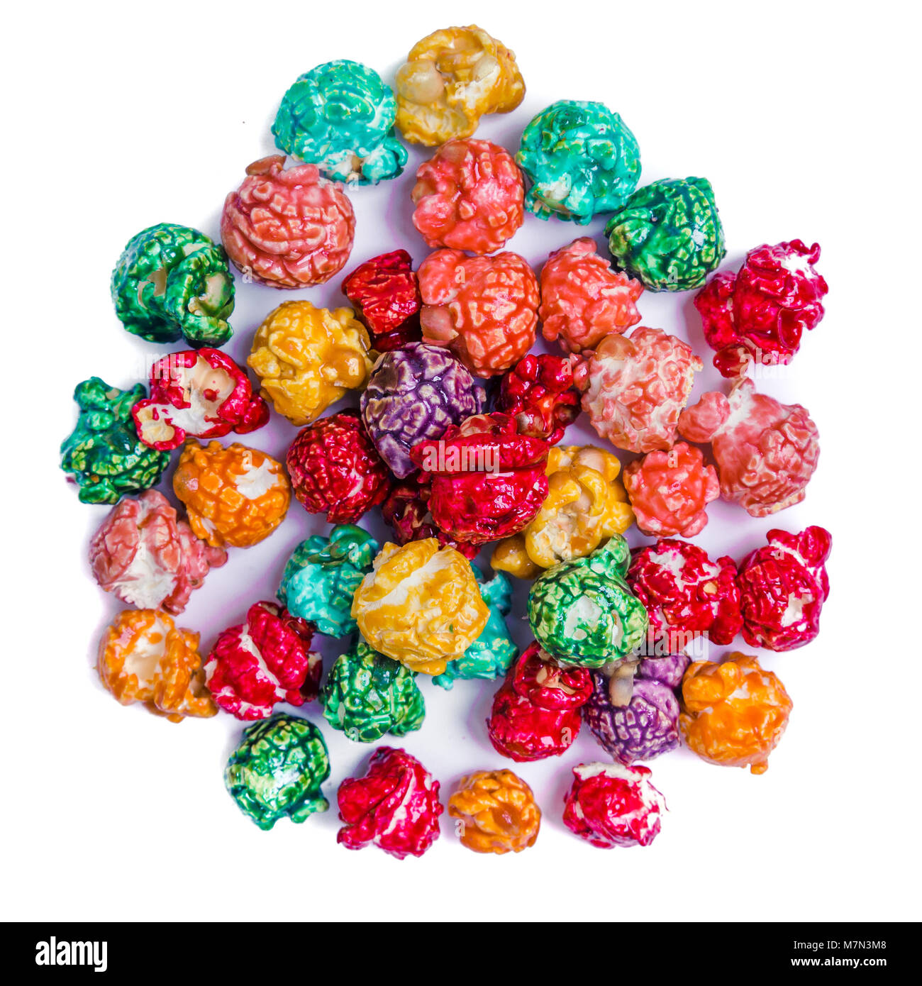 Brightly Colored Candied Popcorn, white background. Horizontal image of ...