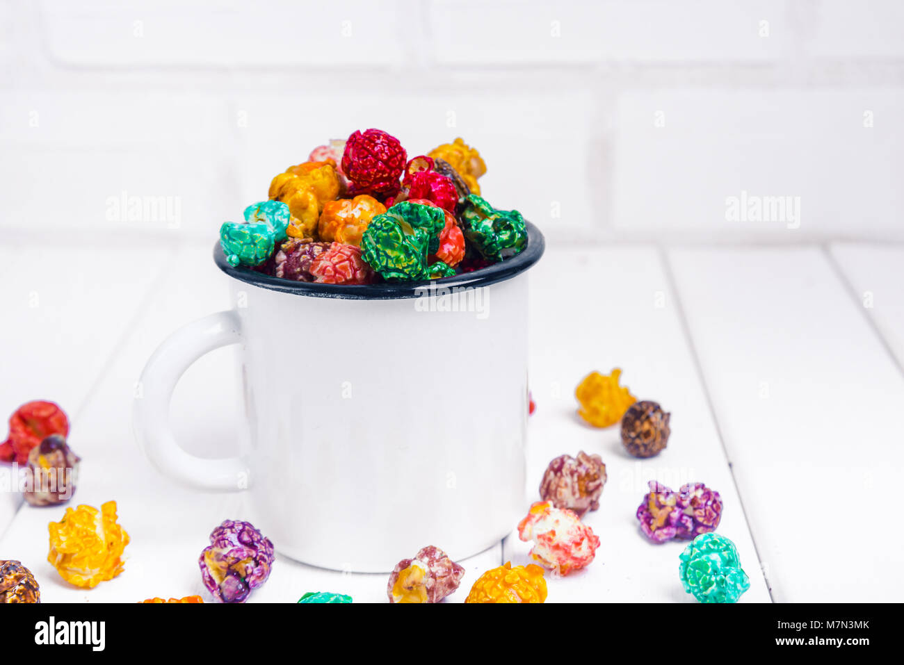 Brightly Colored Candied Popcorn, white background. Horizontal image of ...