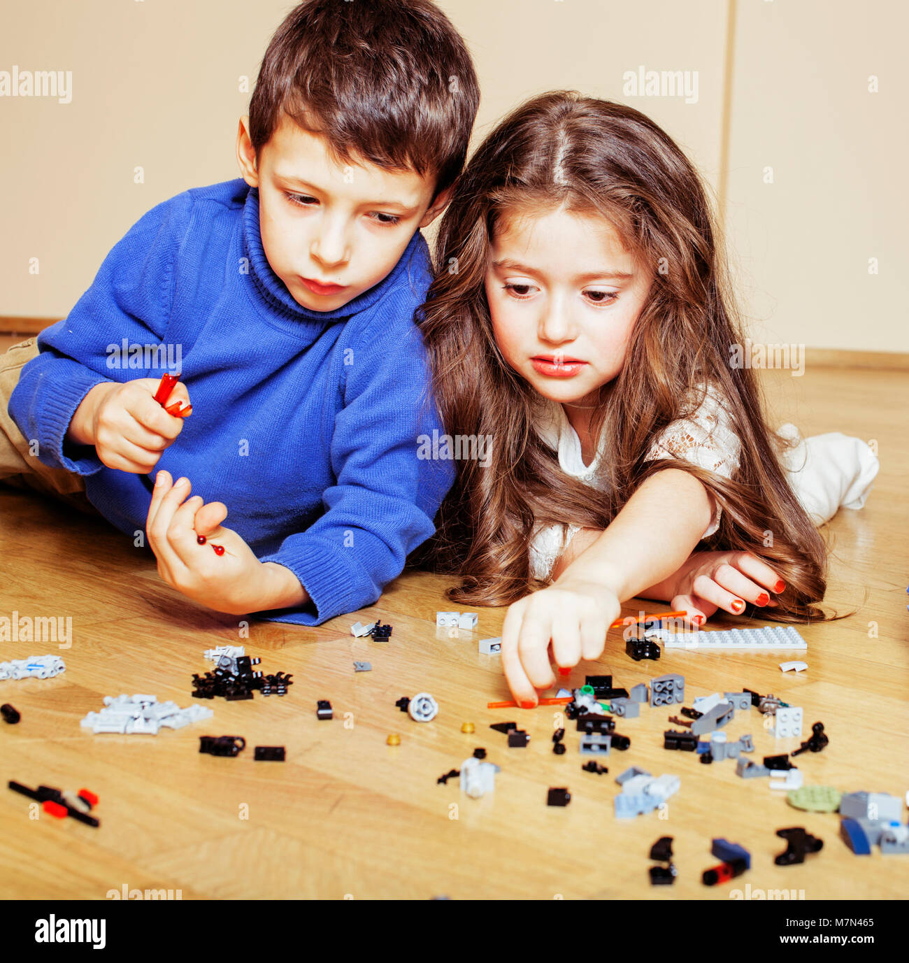 funny cute children playing toys at home, boys and girl smiling Stock ...
