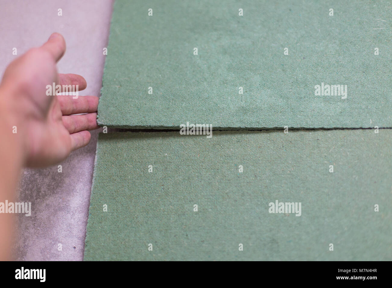 Insulated underlay on floor ready for the click lock wood effect ...