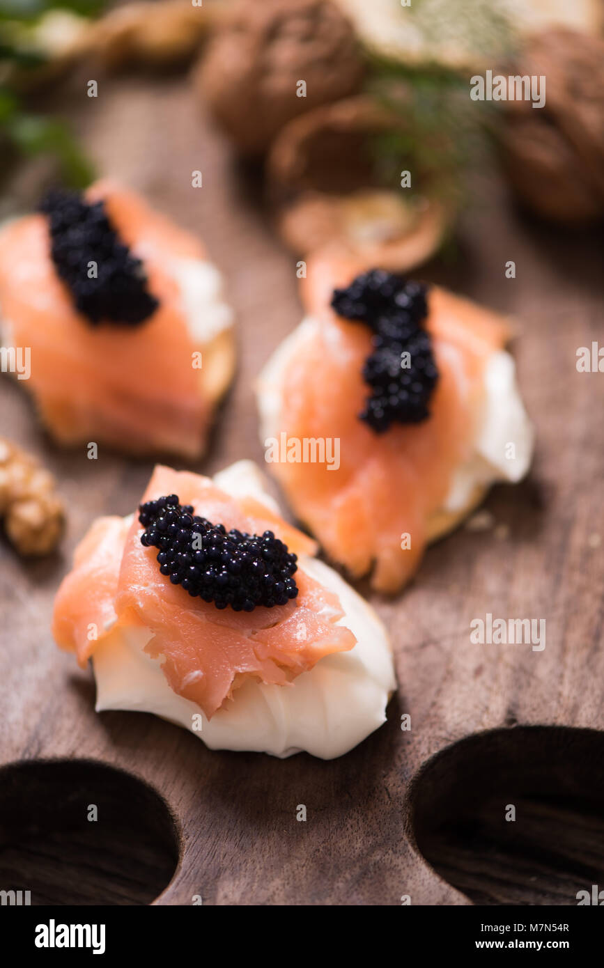 Canapes with smoked salmon and caviar Stock Photo - Alamy