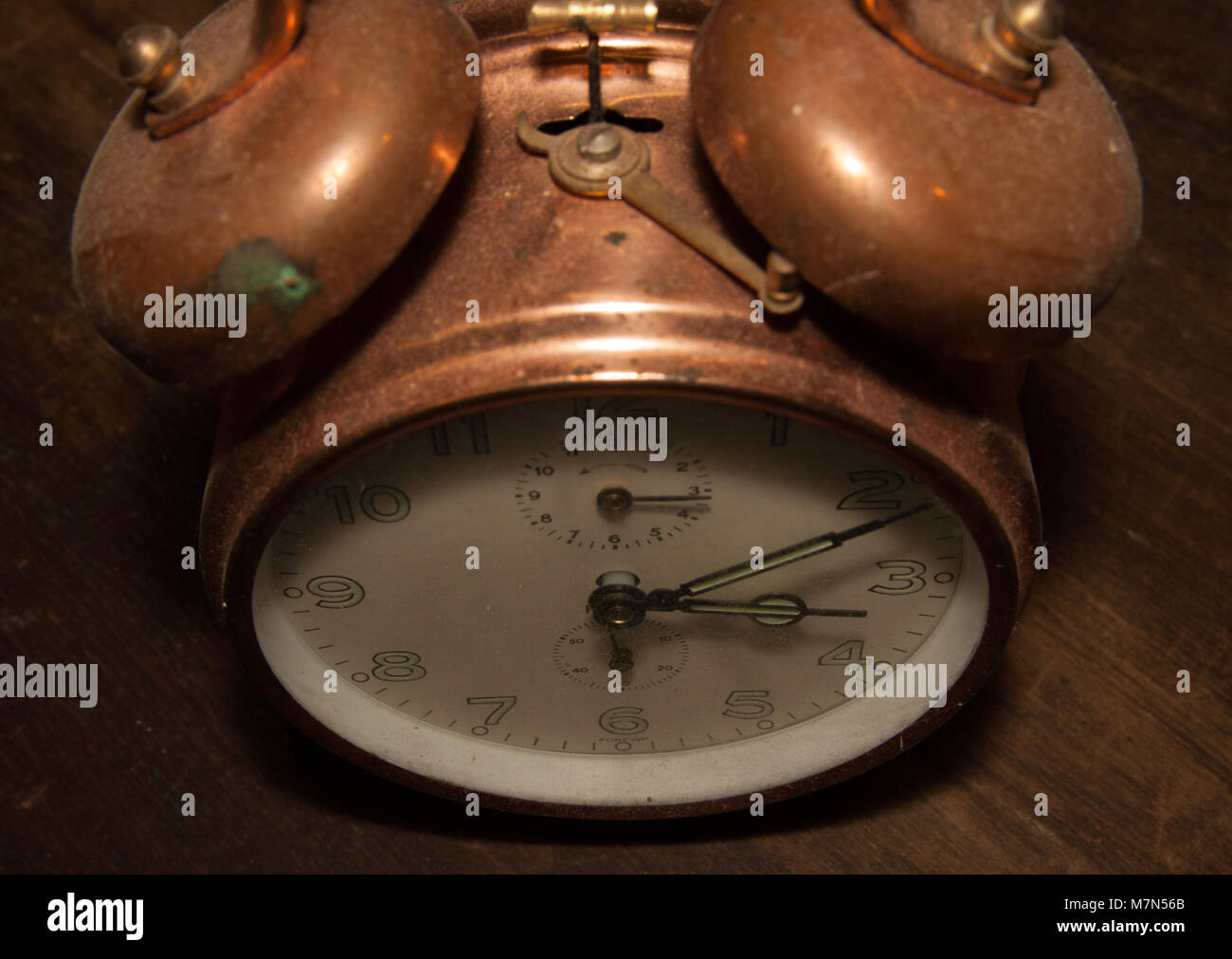 Old wind up brass alarm clock with big alarm hi-res stock photography ...