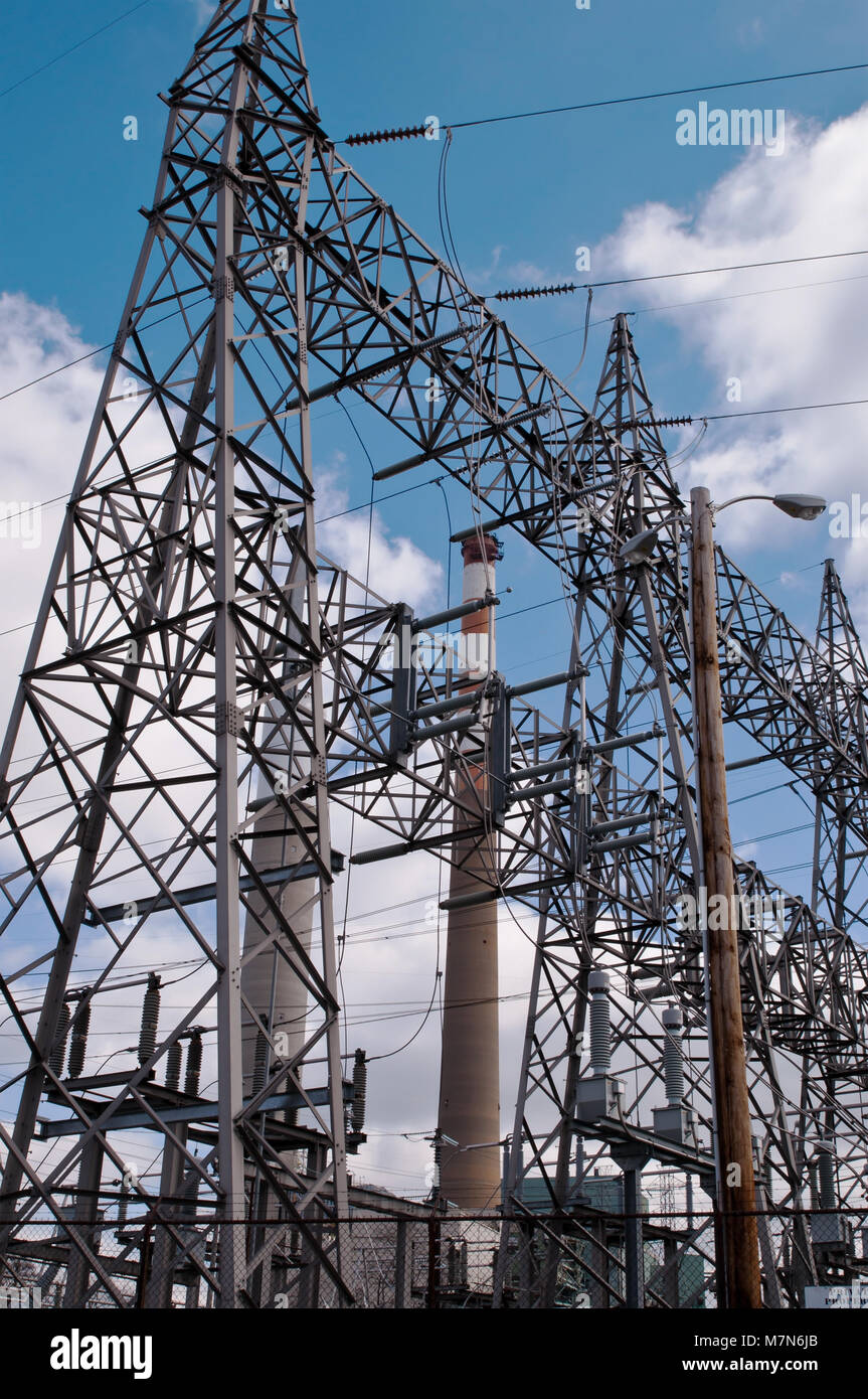 A high voltage electricity power sub station under a bright blue sky ...