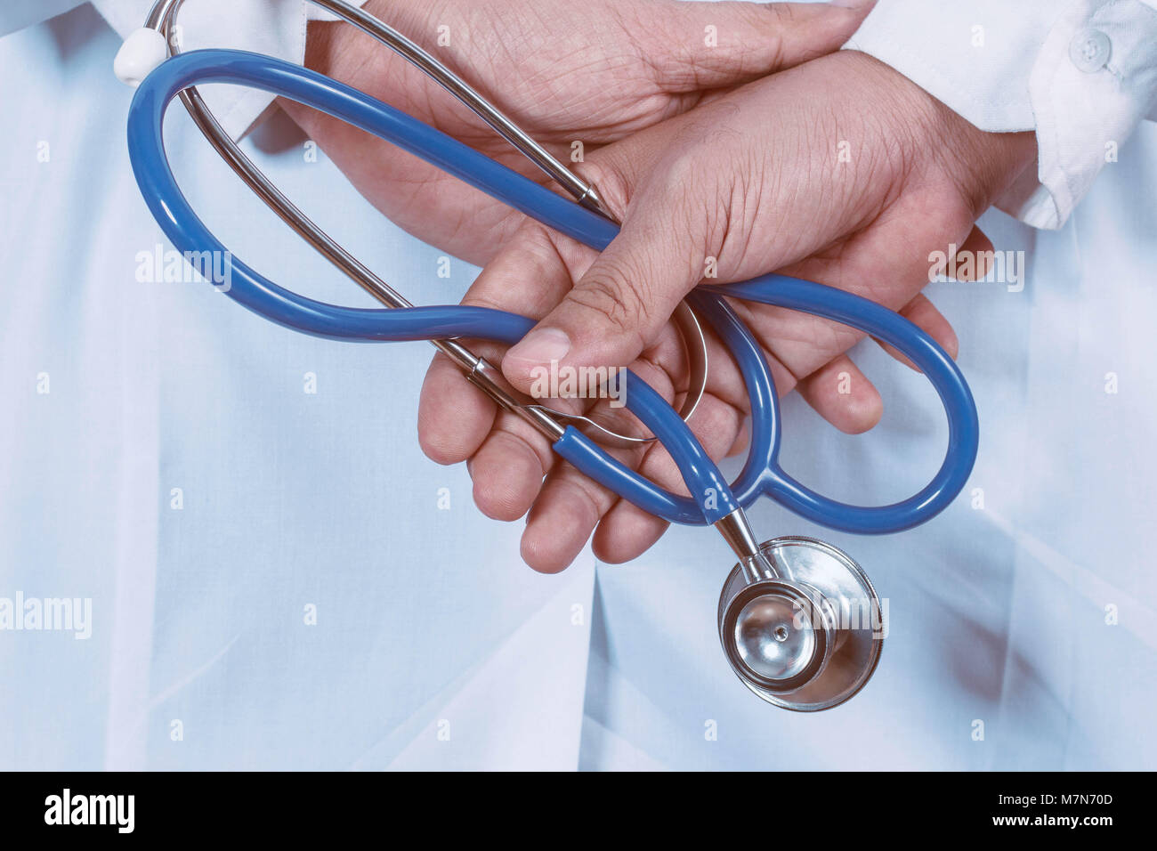 Doctor with fever instrument in hand Stock Photo - Alamy