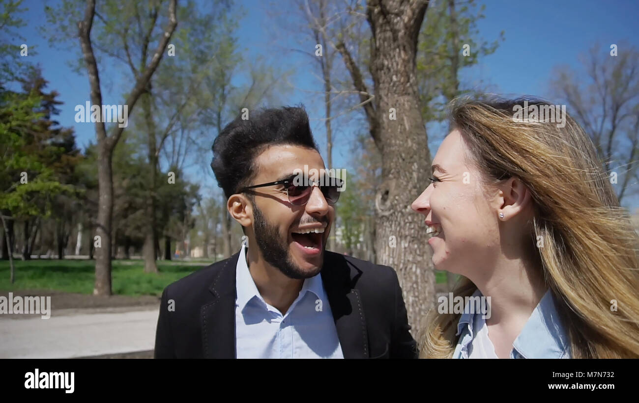 Marriage couple go to kindergarten thought park and laughing Stock ...