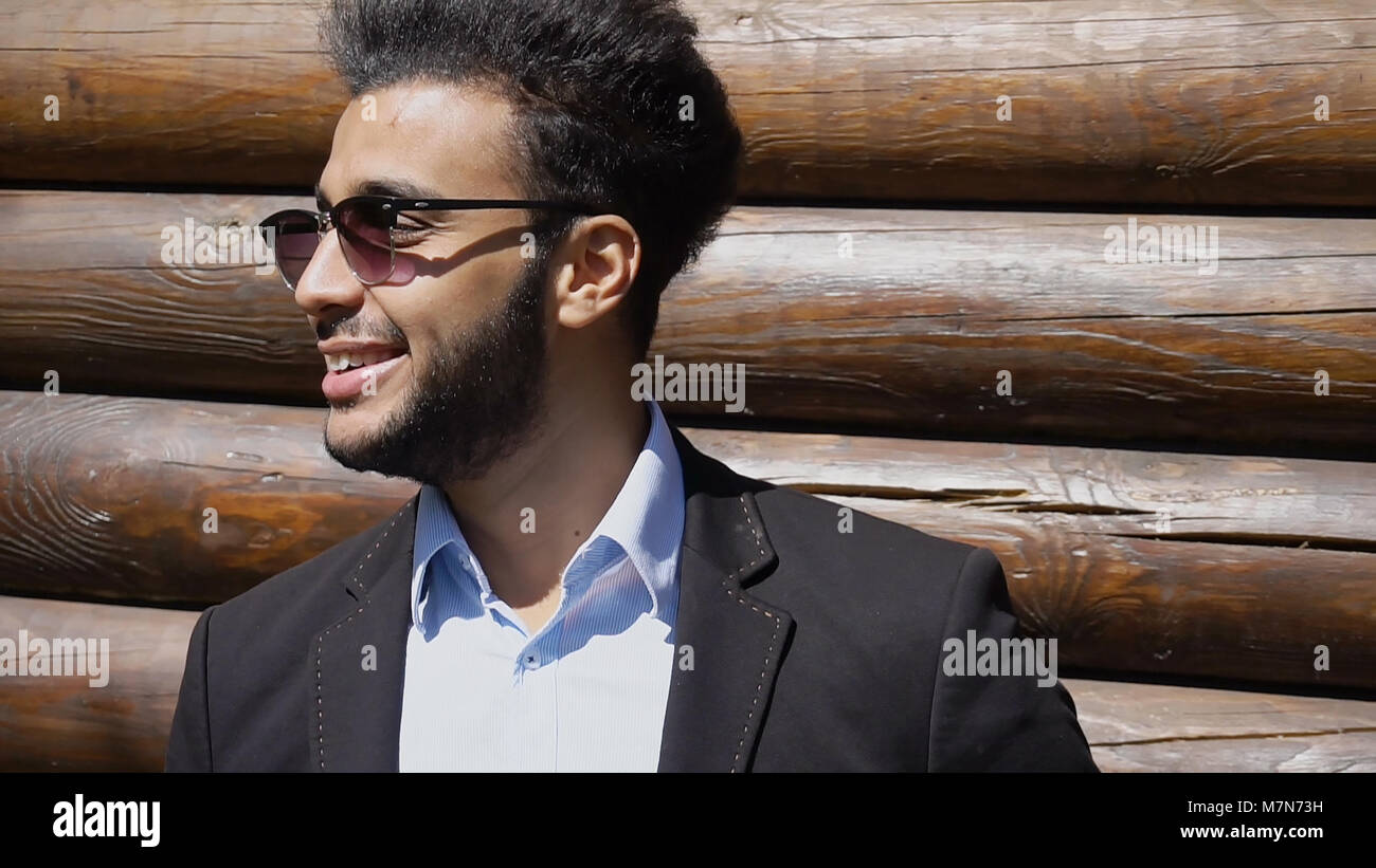 Italian man buttons up snap on jacket Stock Photo - Alamy