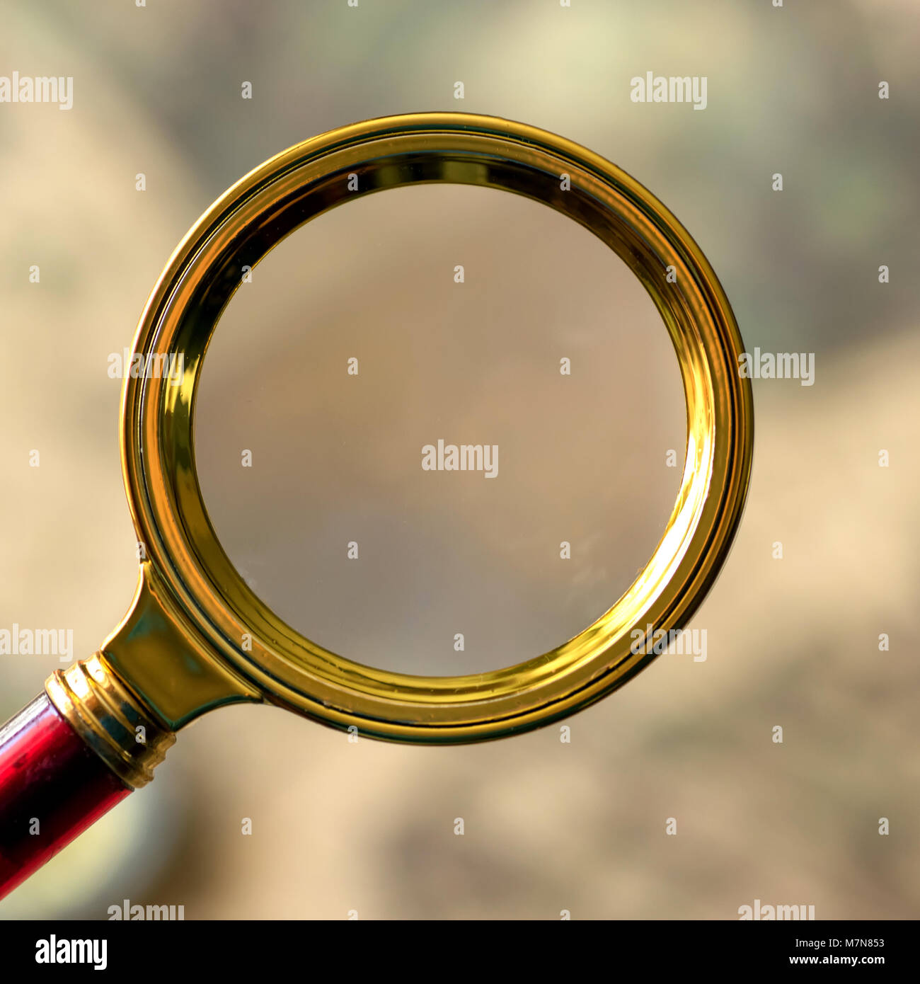 Retro magnifier with old map closeup Stock Photo - Alamy