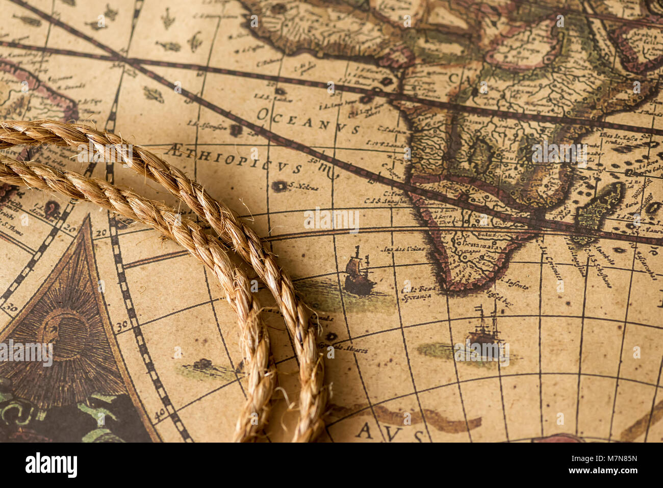 Rope on the old map. Retro style Stock Photo - Alamy