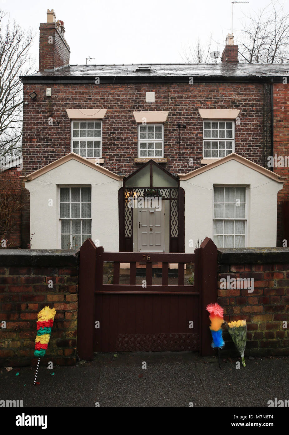Floral tributes outside the Liverpool home of comedy legend Sir Ken ...