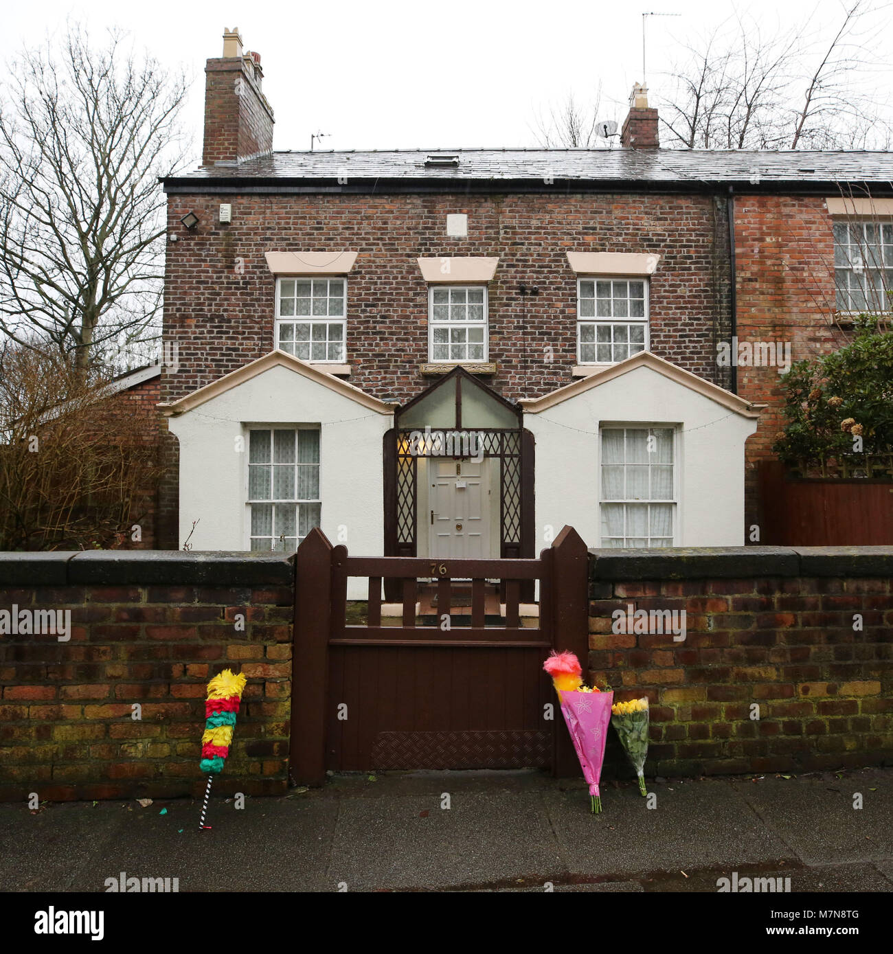 Floral tributes outside the Liverpool home of comedy legend Sir Ken ...
