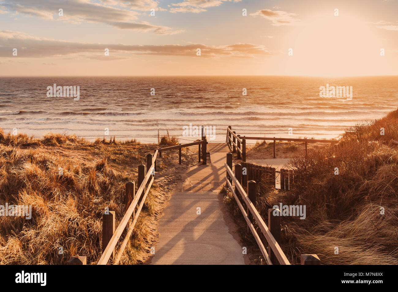 wooden pier overlooking the sea at sunset Stock Photo - Alamy