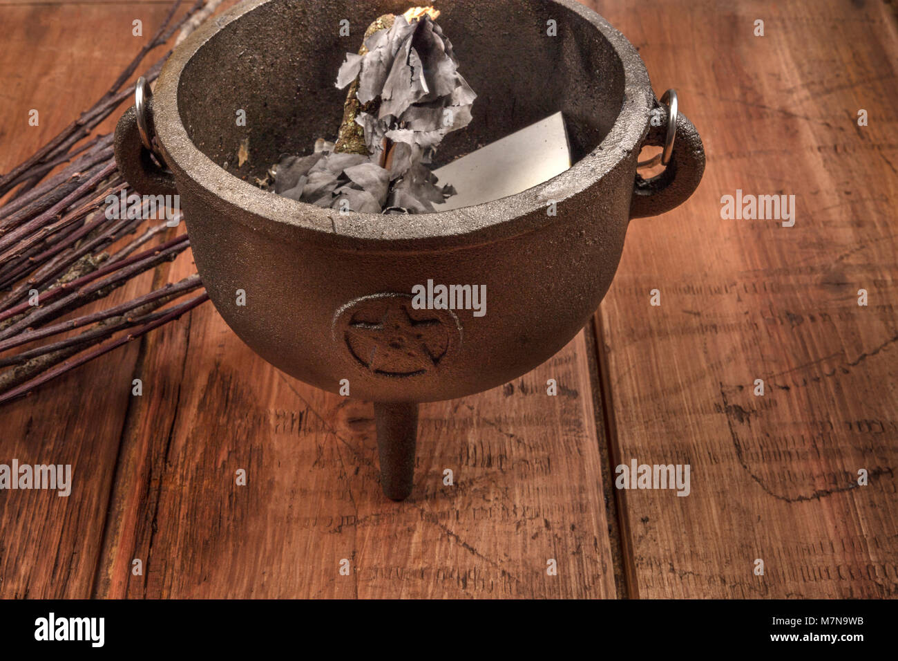 Photo of witch's cauldron and a broom Stock Photo - Alamy