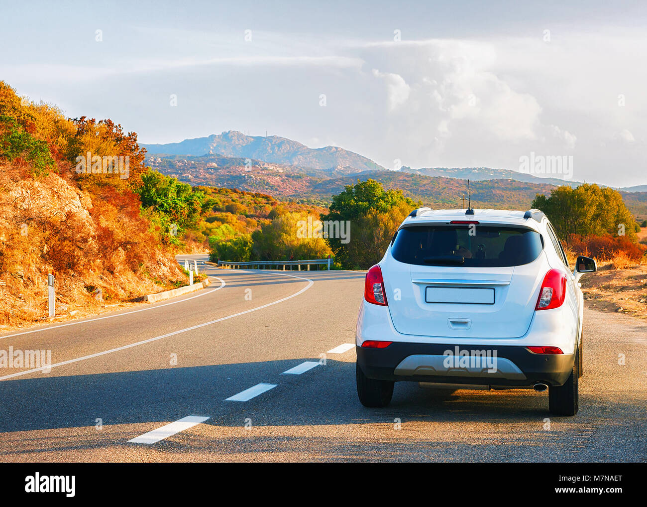 White car on the road in Costa Smeralda, Sardinia, Italy Stock Photo ...