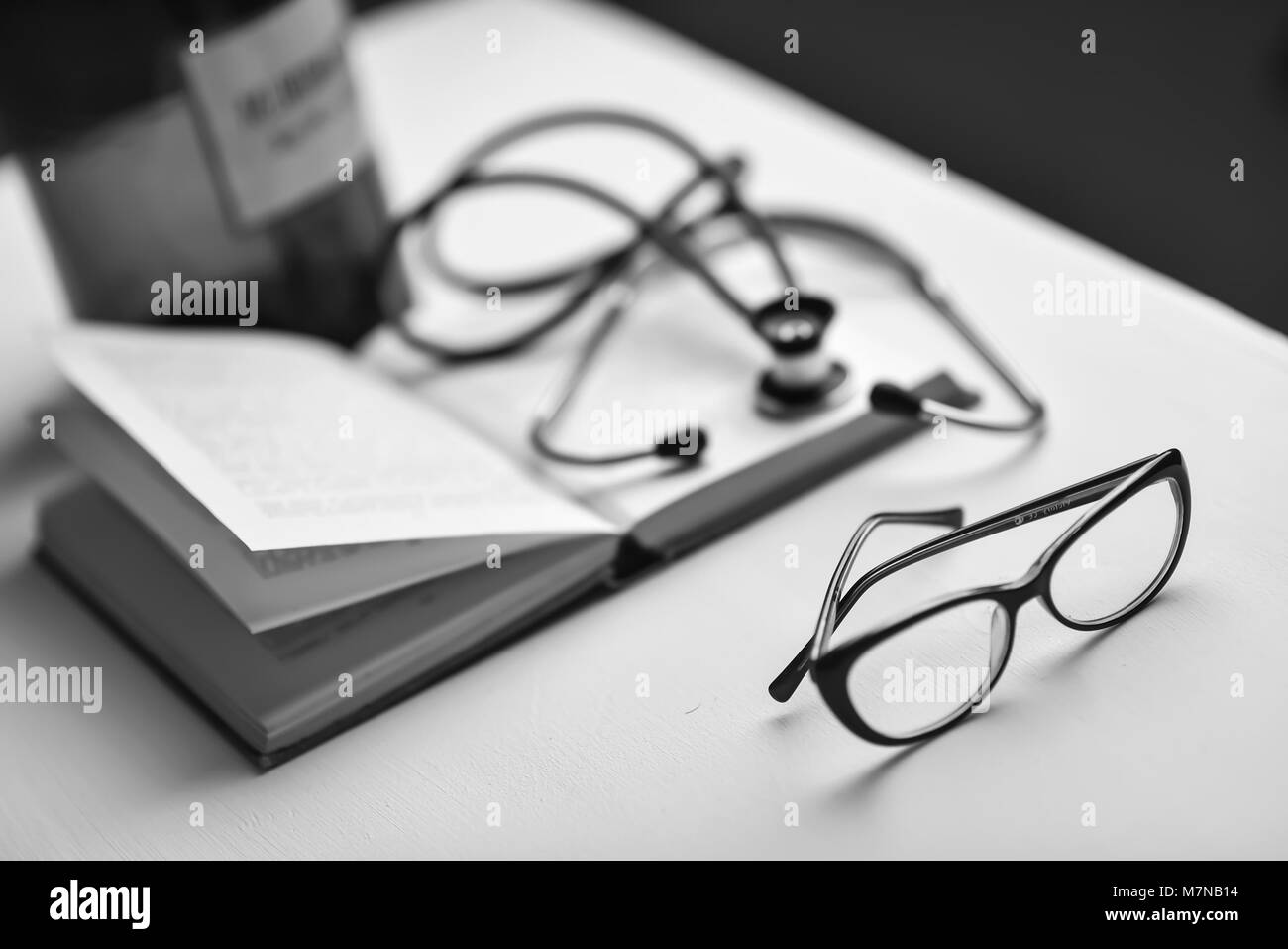 Stethoscope and book on Desk Stock Photo - Alamy
