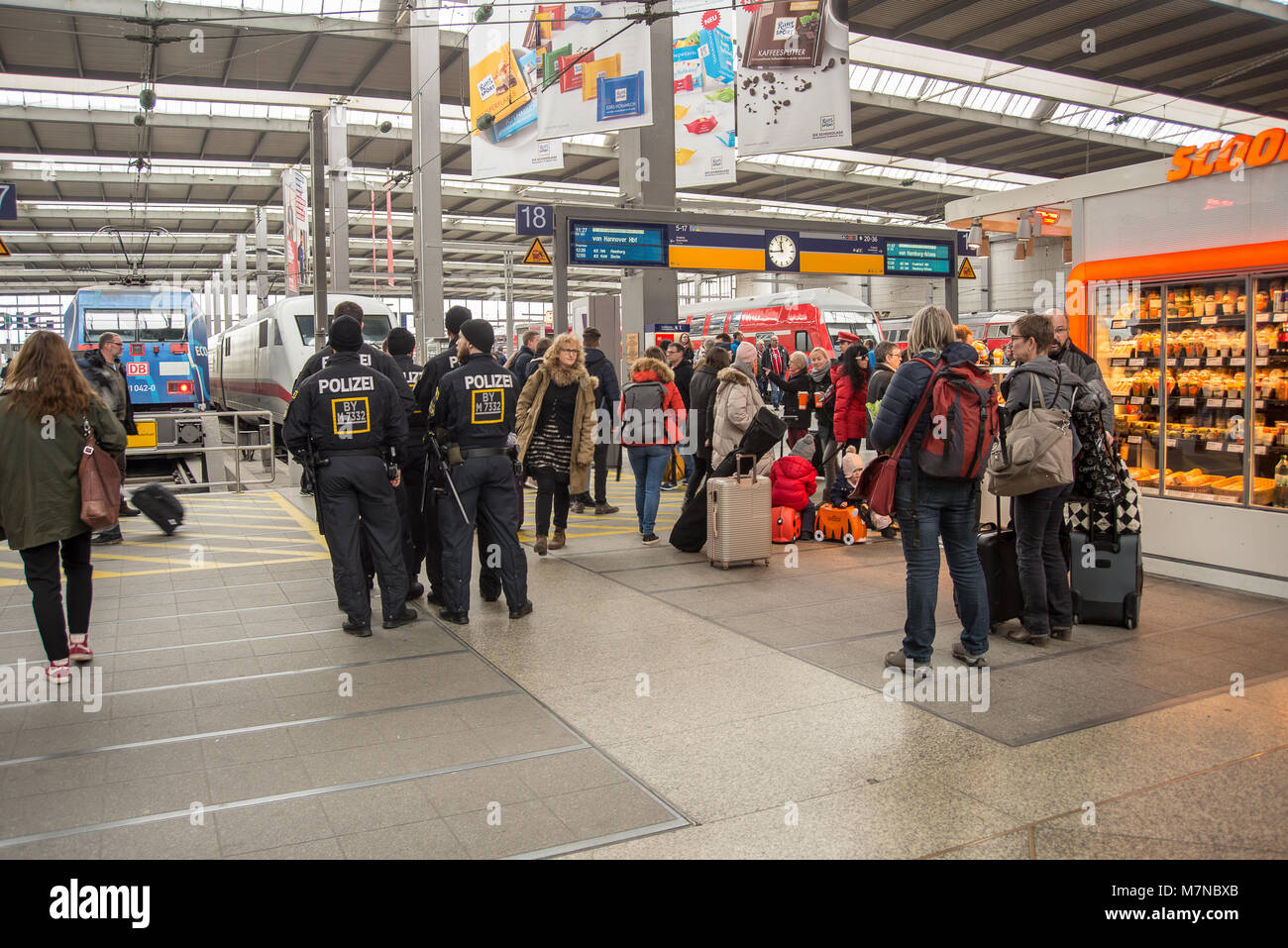 A group of riot police officers wait for football fans from Hamburg to ...