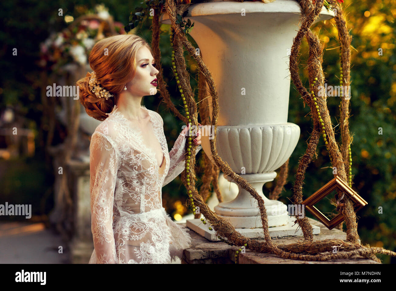 Elegant female model wearing maxi dress and white lace jacket with long ...