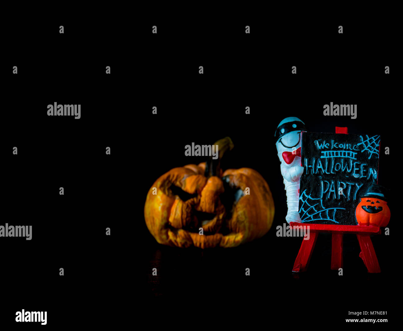 Welcome halloween party notice board on black background, blurred image ...