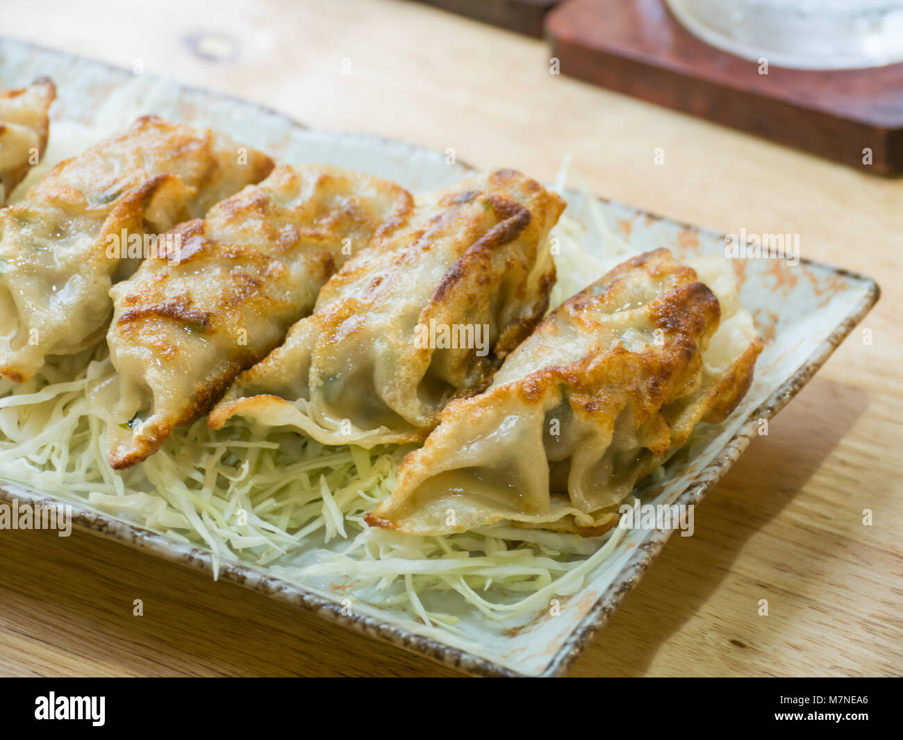 Gyoza in wood background hi-res stock photography and images - Alamy