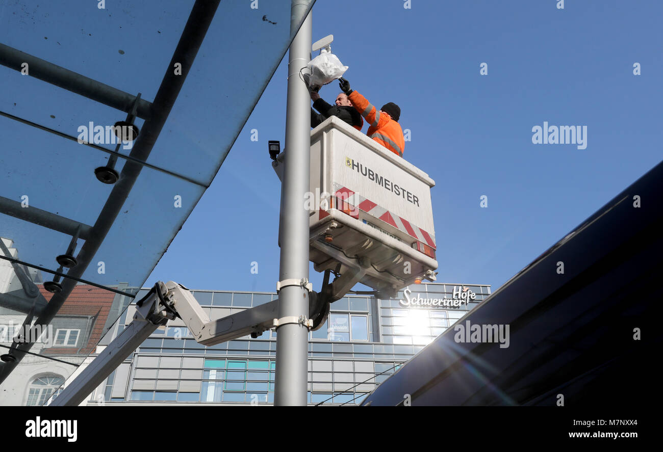 20 February 2018, Germany, Schwerin: Technicians install a CCTV camera ...