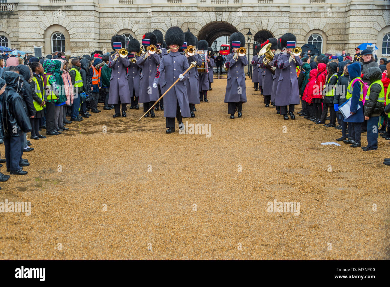 London, UK. 12th March, 2018. The Band Marches offflanked by teh choir ...