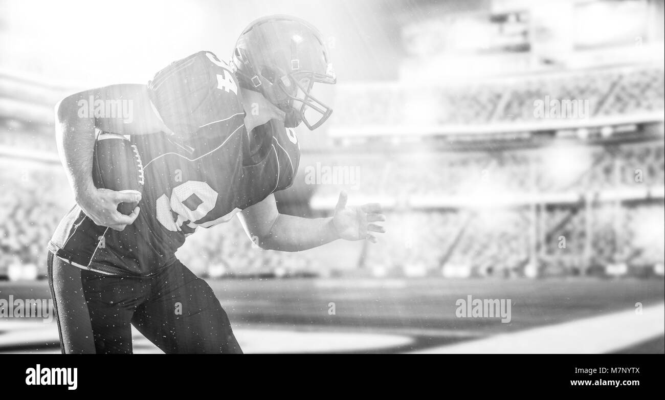 American football Player running with the ball isolated on big modern ...