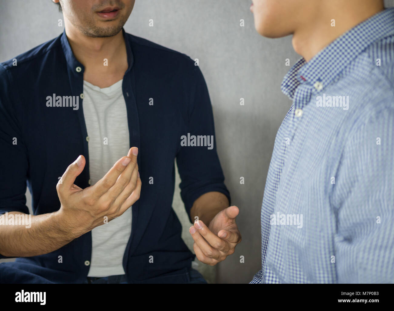 Men discussion in close up Stock Photo - Alamy