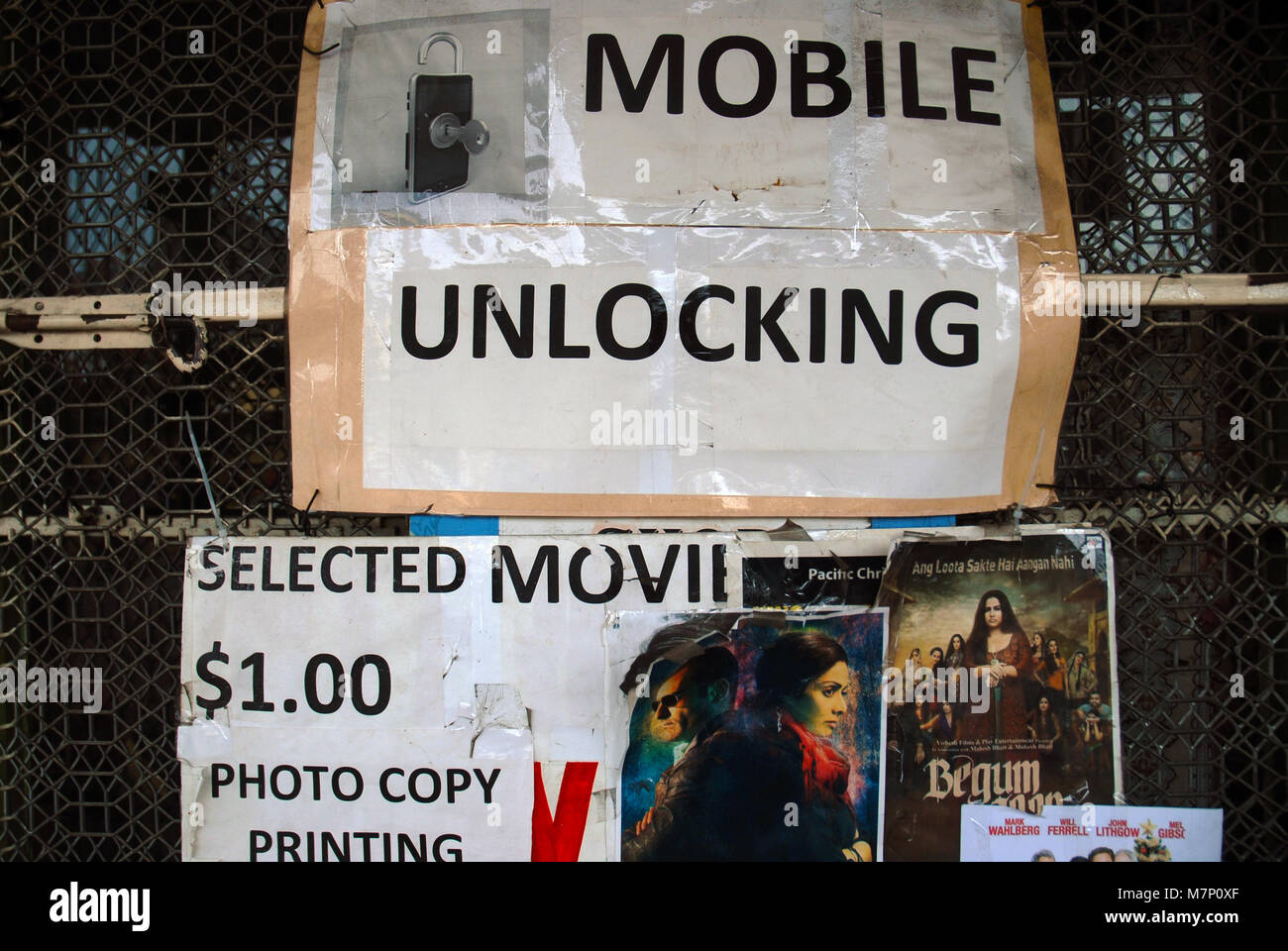 Mobile Unlocking Sign, Lautoka, Fiji Stock Photo - Alamy