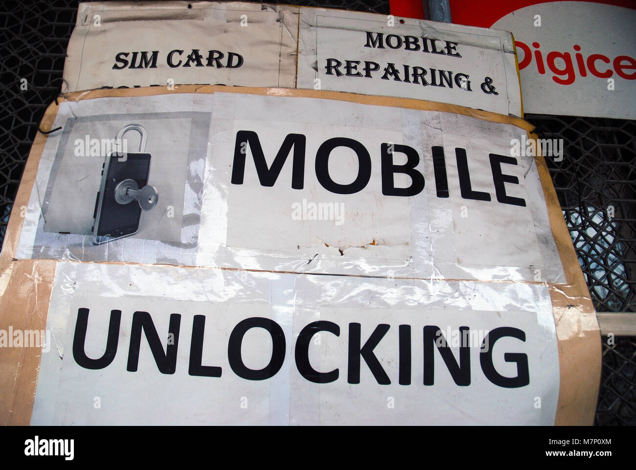 Mobile Unlocking Sign, Lautoka, Fiji Stock Photo - Alamy