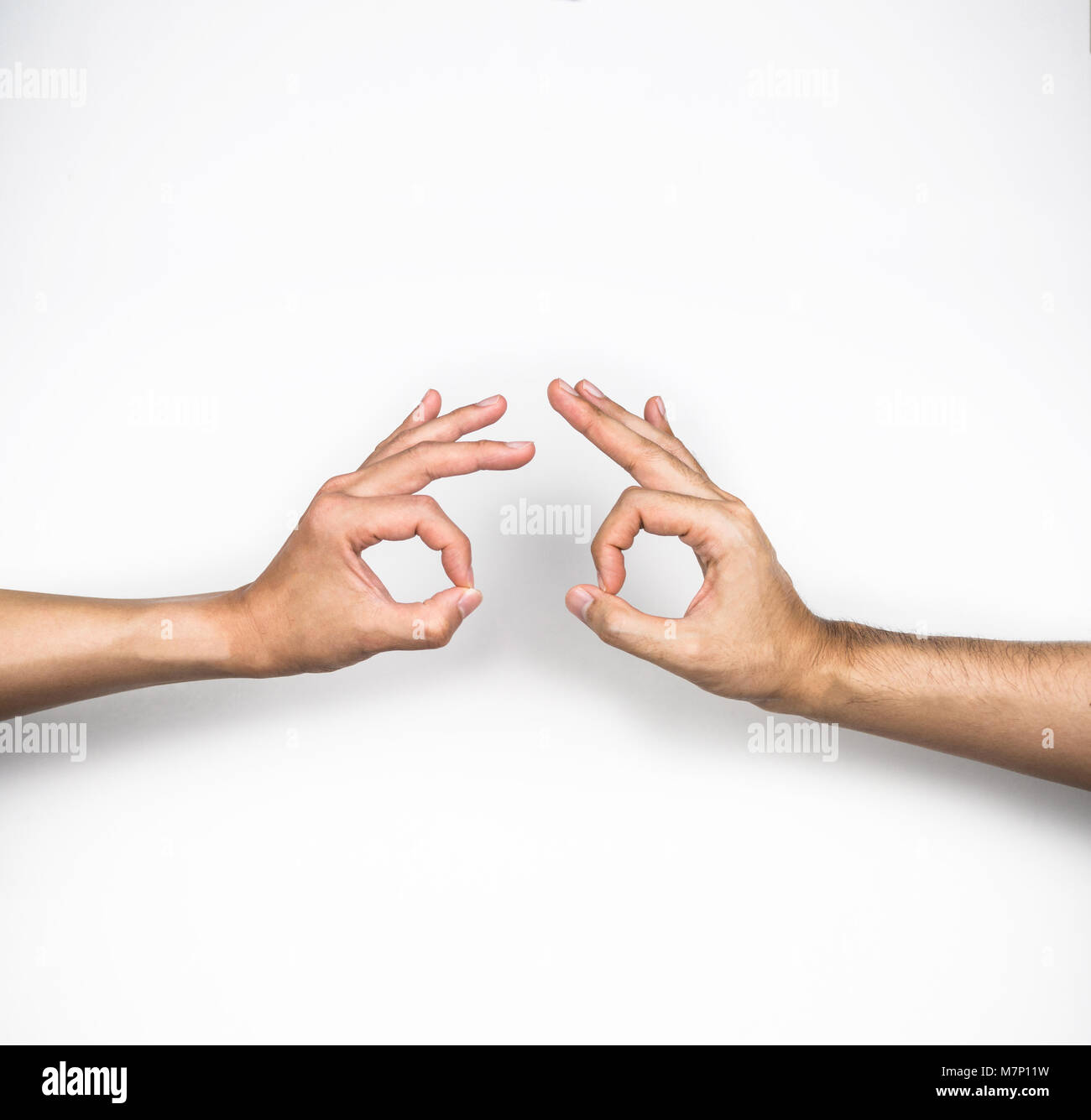 Ok, two hands agree gestures on white background Stock Photo - Alamy